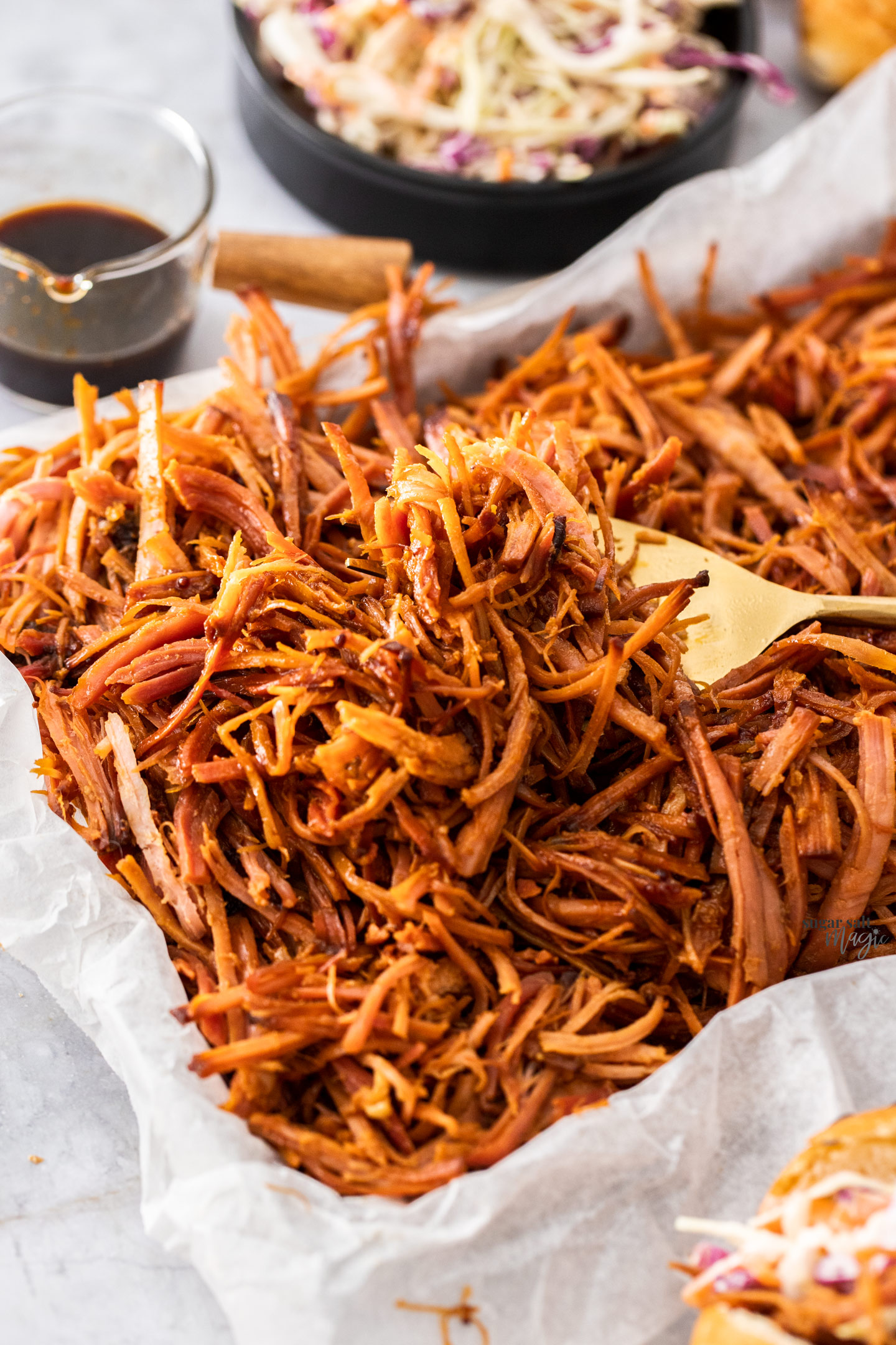 A pile of pulled ham in a tray.
